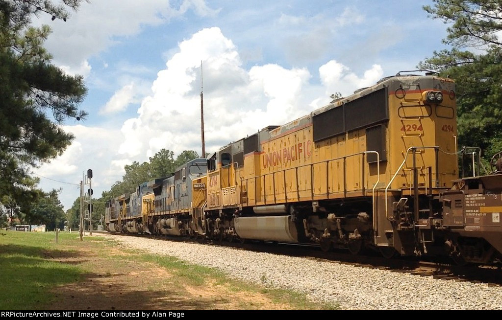 CSX AC44CW 244 leads sister-unit 279, C40-8W 7926, and UP SD70M 4294